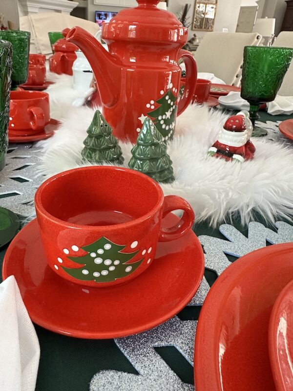A German Christmas Tablescape set with beautiful red stoneware.